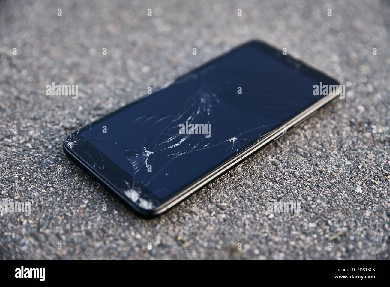 Damaged smartphone with broken touch screen on the asphalt Stock Photo ...