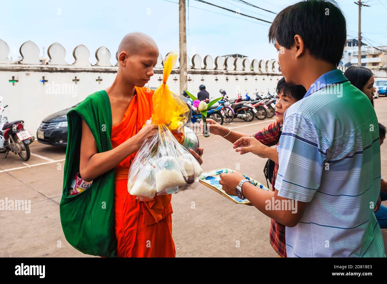 Monk receiving food, Ayutthaya, Thailand Stock Photo - Alamy