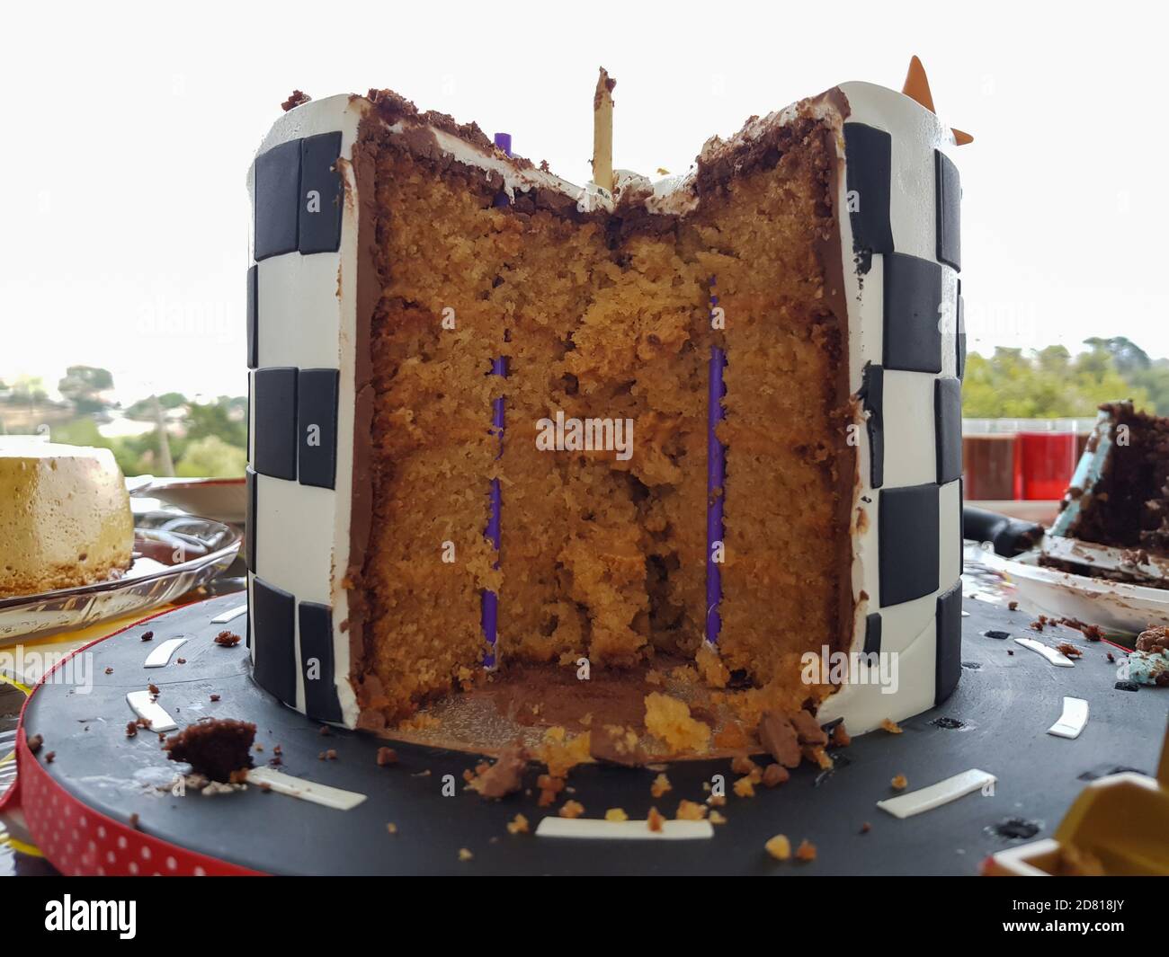 Sliced birthday cake with delicious filling Stock Photo - Alamy