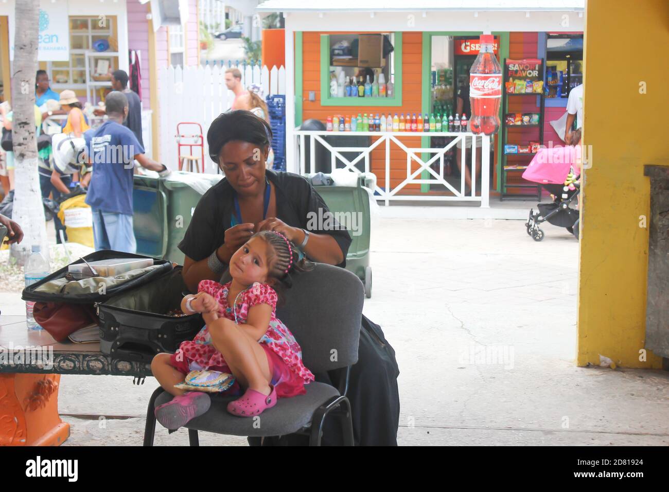Hair braiding, Nassau, Bahamas ,Anonymous woman braiding hair of little ...