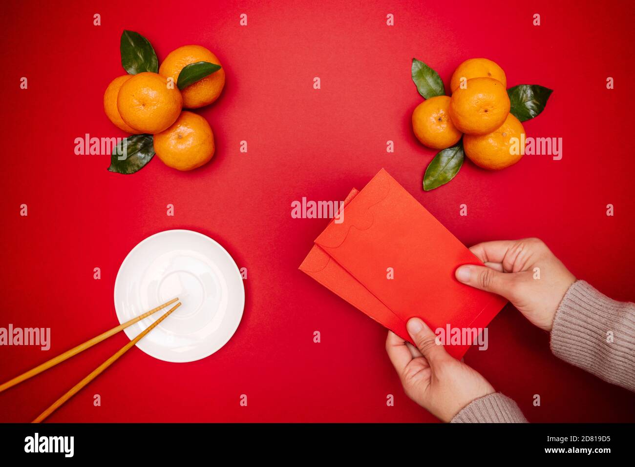 Flat lay Chinese lunar new year traditional food and offering red ...