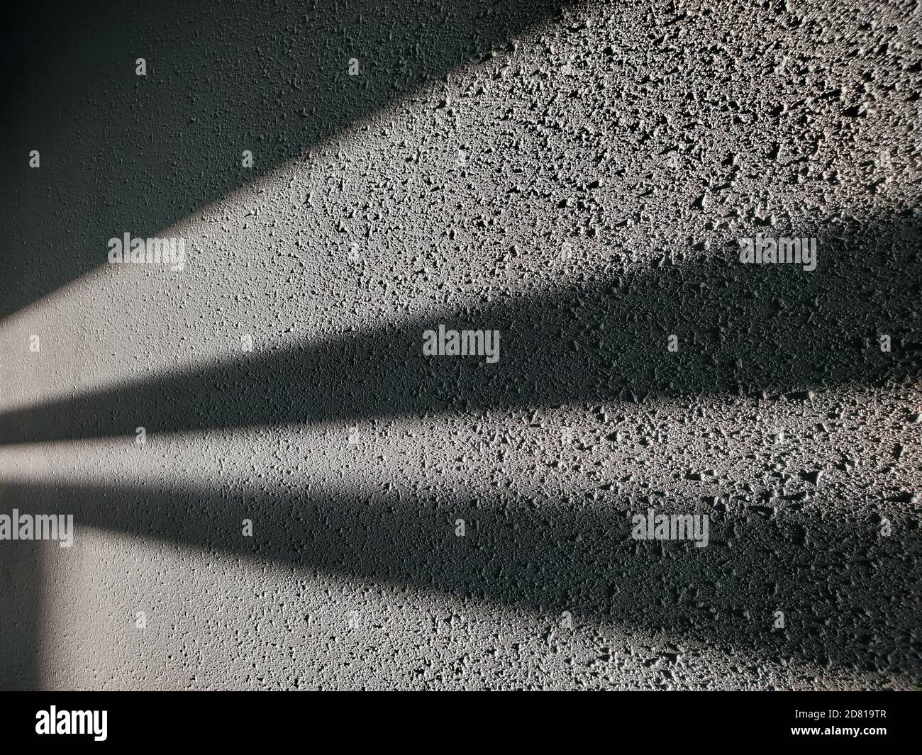 Abstract geometric shadows look like rays of spotlight in darkness ...