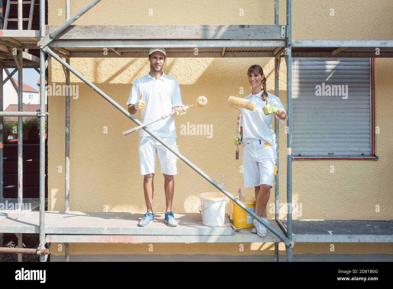 Back view painter painting wall hi-res stock photography and images - Alamy