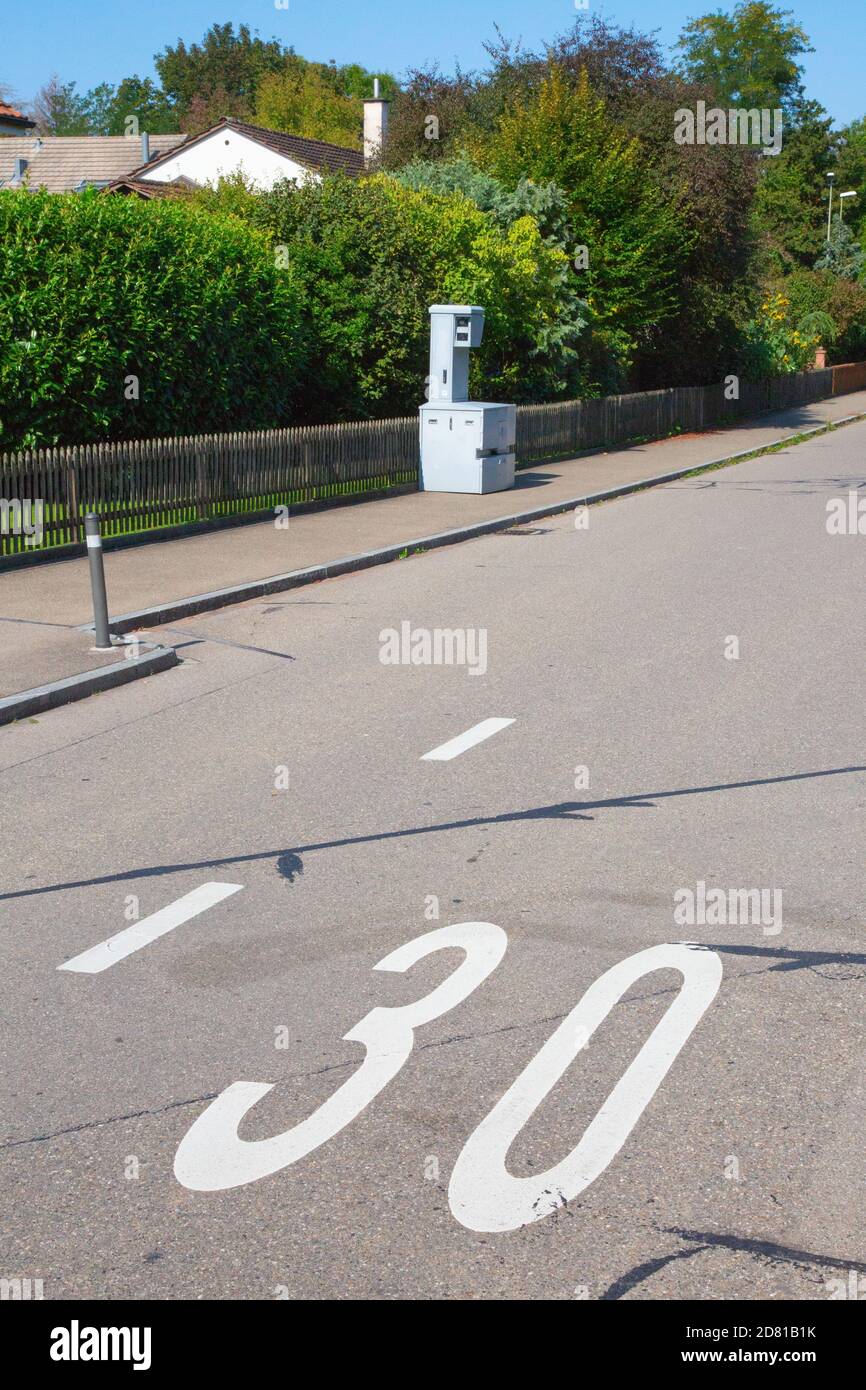 Speed camera on the narrow street of small swiss city. The 30 km/h is ...