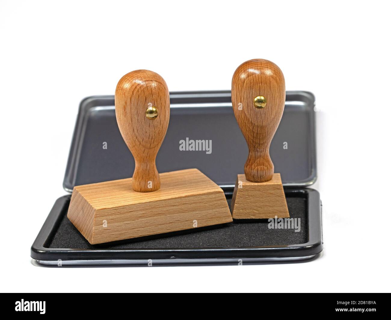 Wooden stamps on a stamp pad against a white background Stock Photo - Alamy