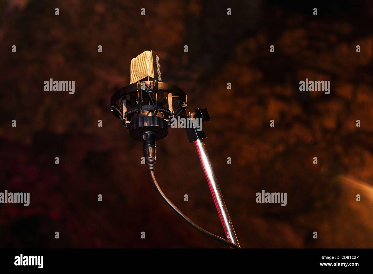 Microphone oncolor background. Retro microphone. A microphone on stage ...