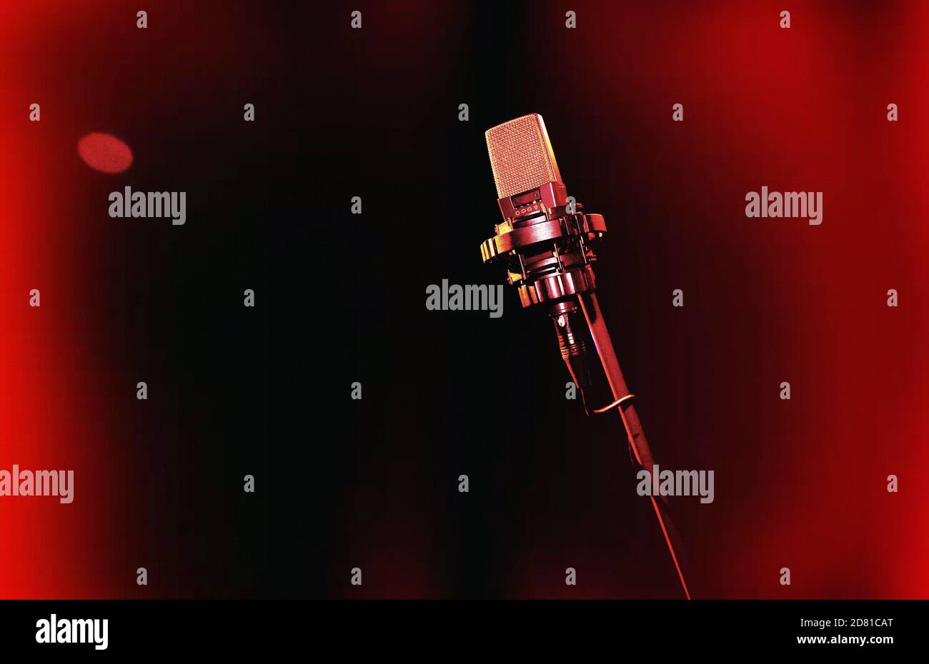 Microphone on red background. Retro microphone. A microphone on stage ...