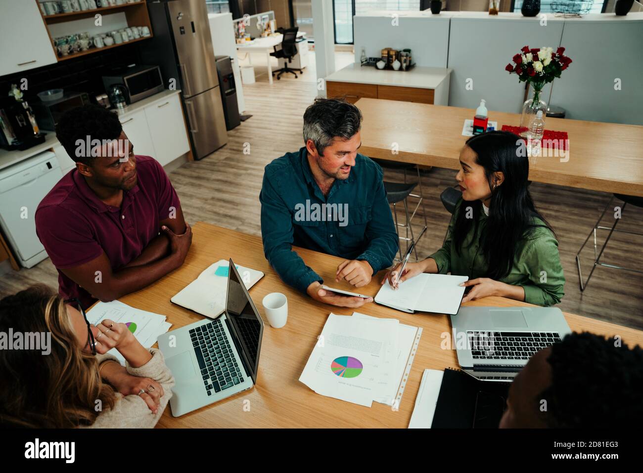 Diverse Business Team Gather In Office Brainstorming Ideas Researching