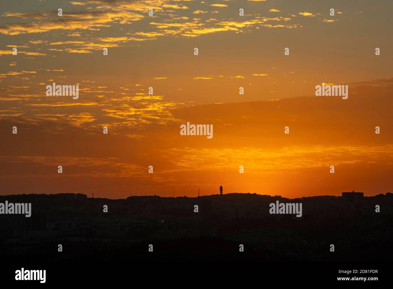 The partly cloudy sky over Jerusalem, Israel, becomes red at the ...