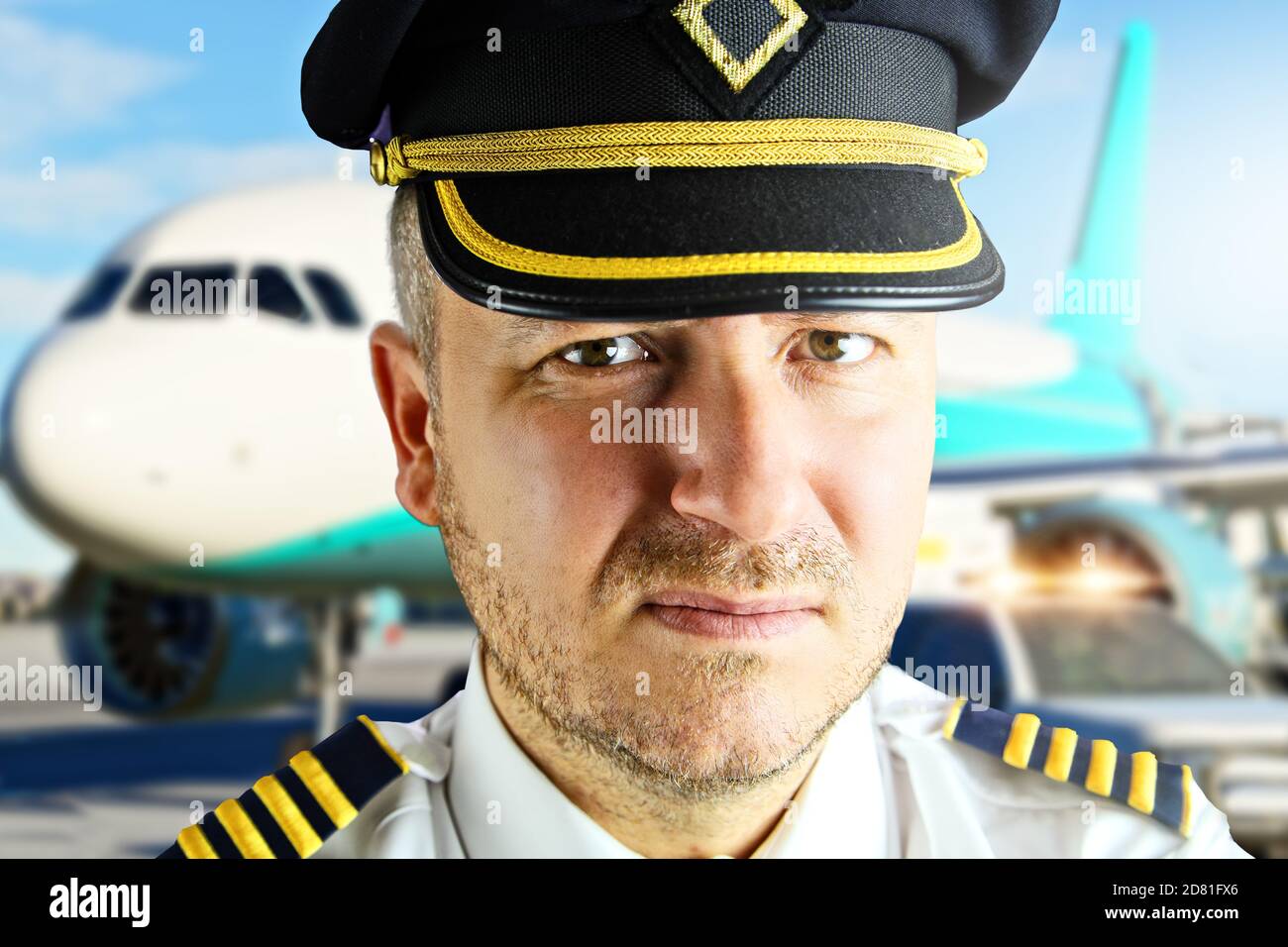 pensive plane captain in uniform at the airport Stock Photo - Alamy