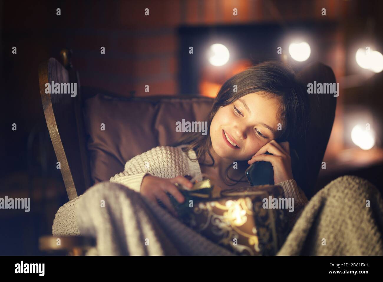 teenage girl talking on the phone with a gift Stock Photo - Alamy