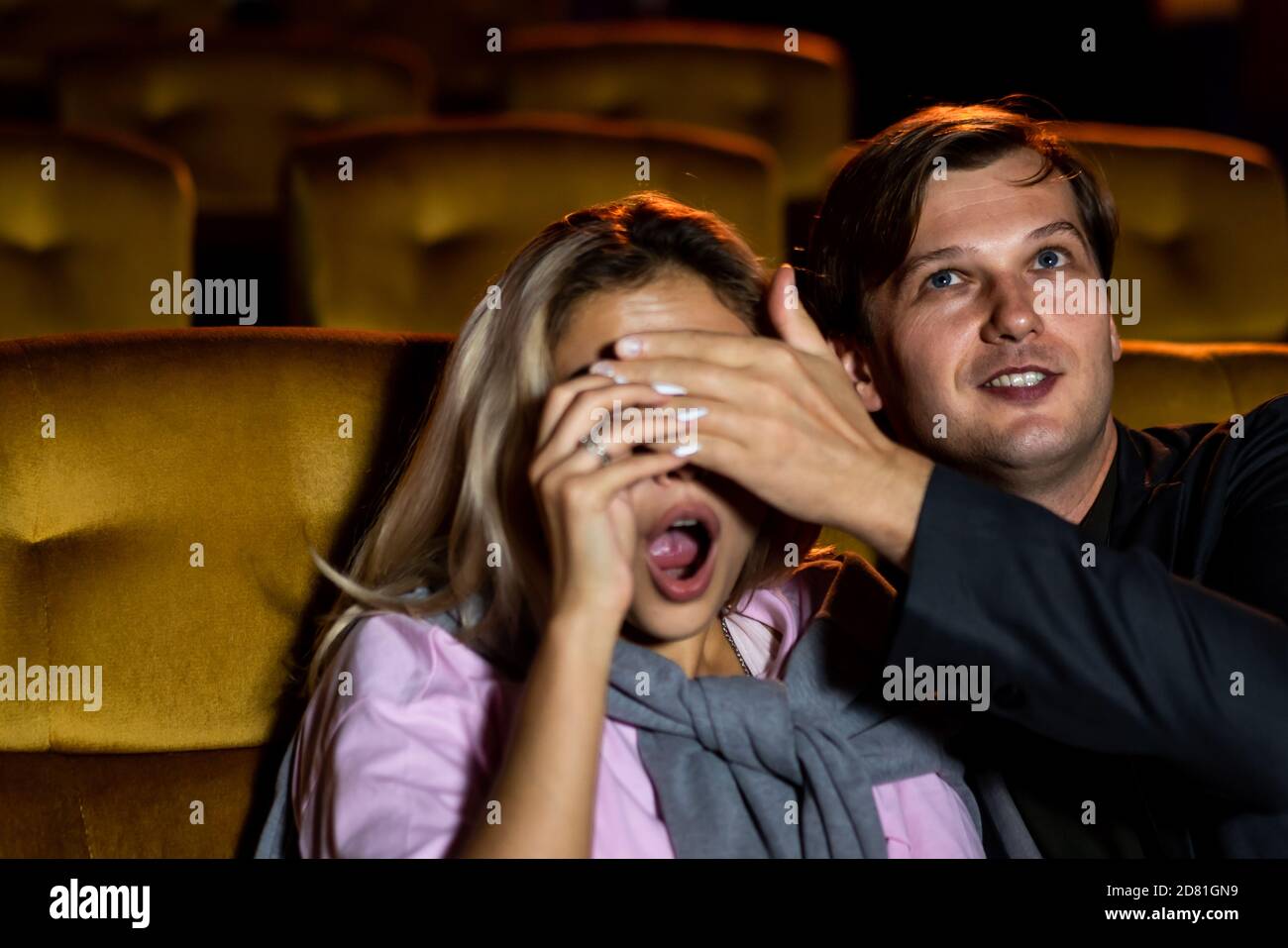 Cinema couple hands hi-res stock photography and images - Alamy