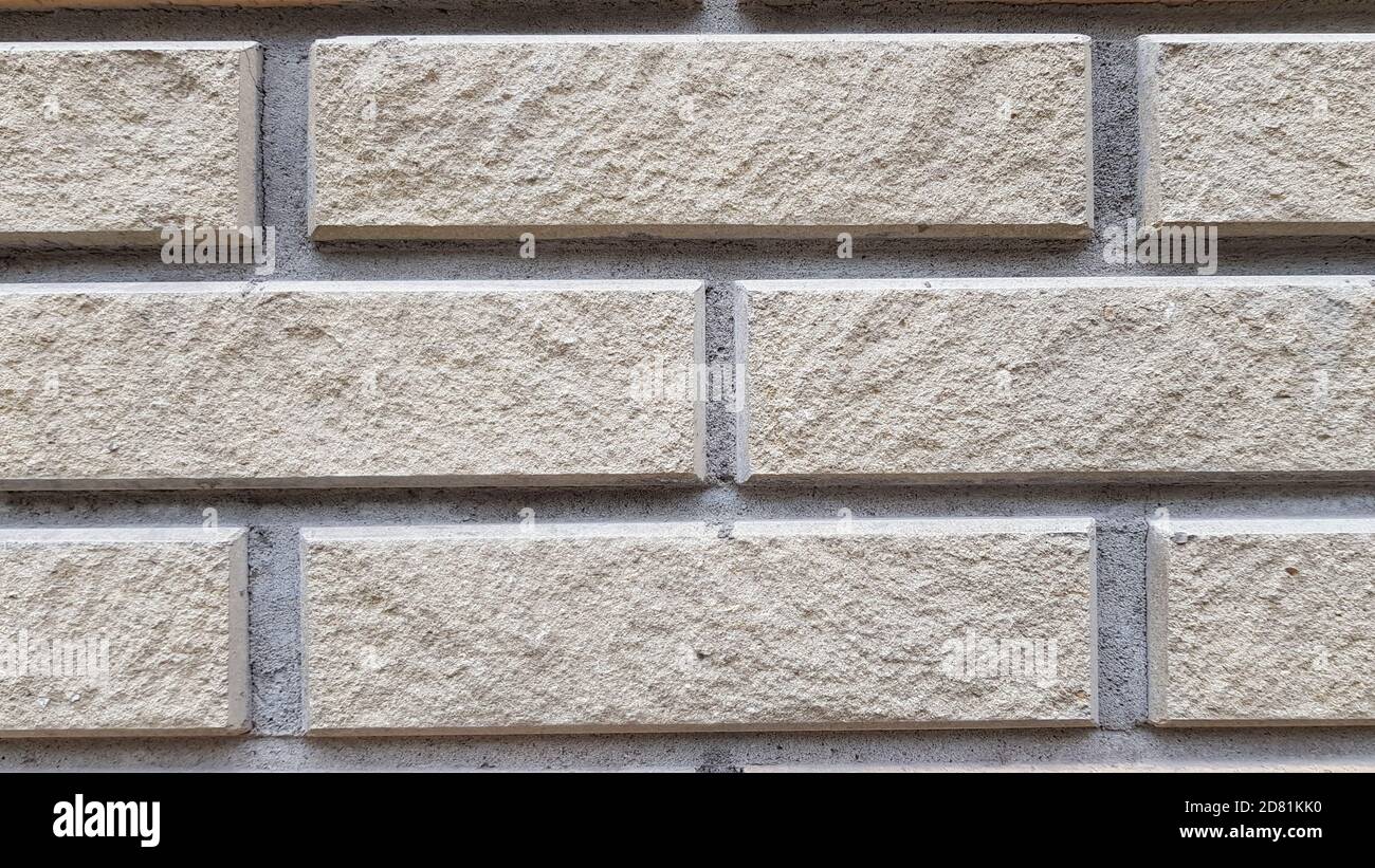 Straight rectangular brick textured background. Bricks with rough ...