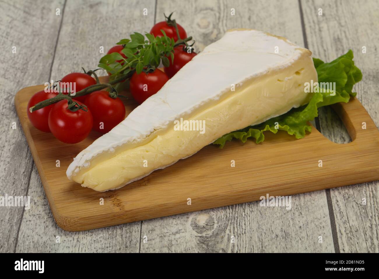 Brie cheese triangle served salad leaves Stock Photo - Alamy