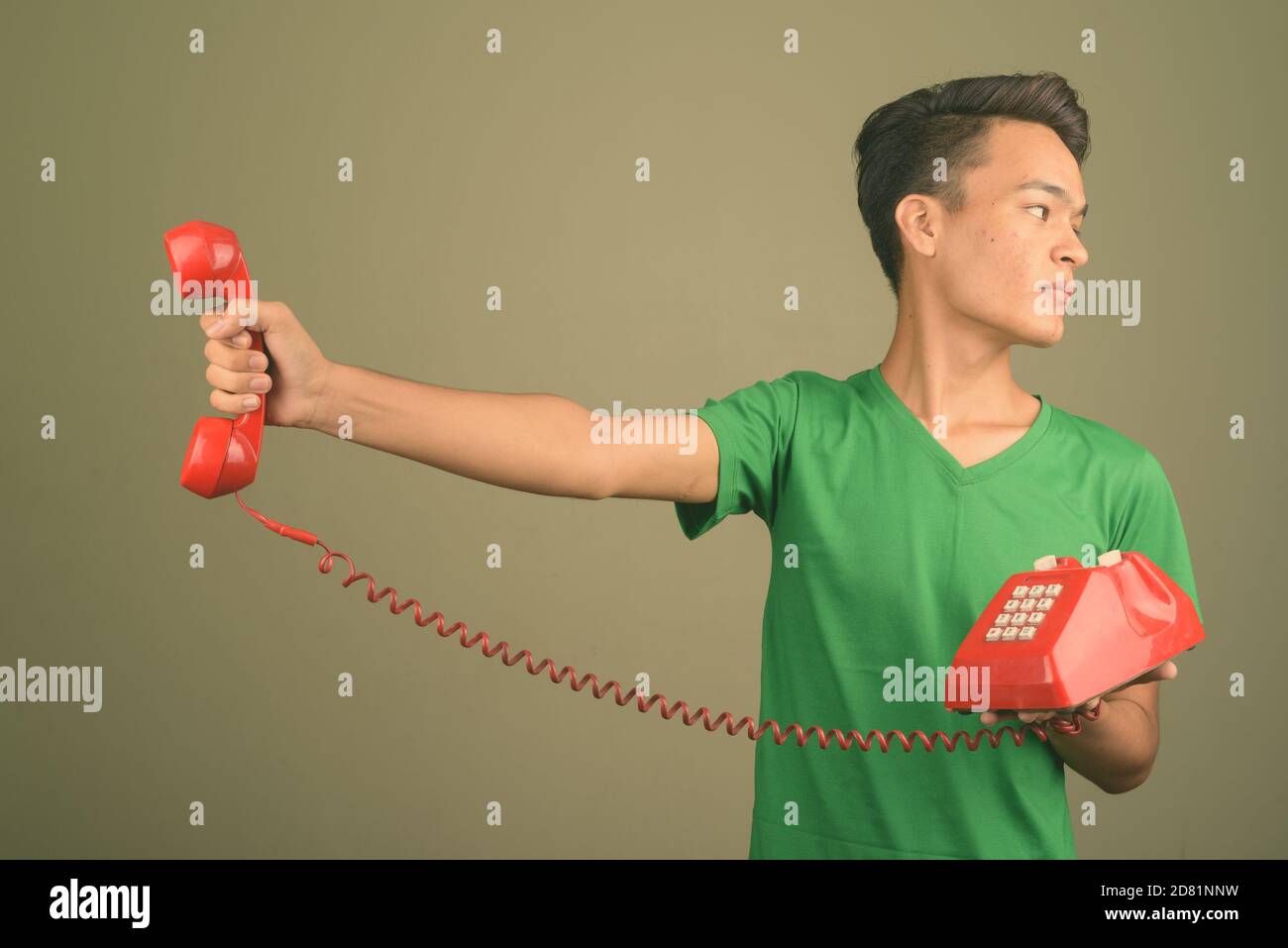 Young handsome Indian man against colored background Stock Photo - Alamy