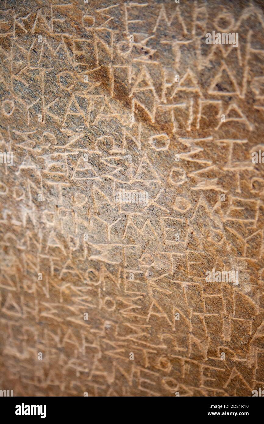 Fragment of the ancient greek letters carved on the stone Stock Photo ...