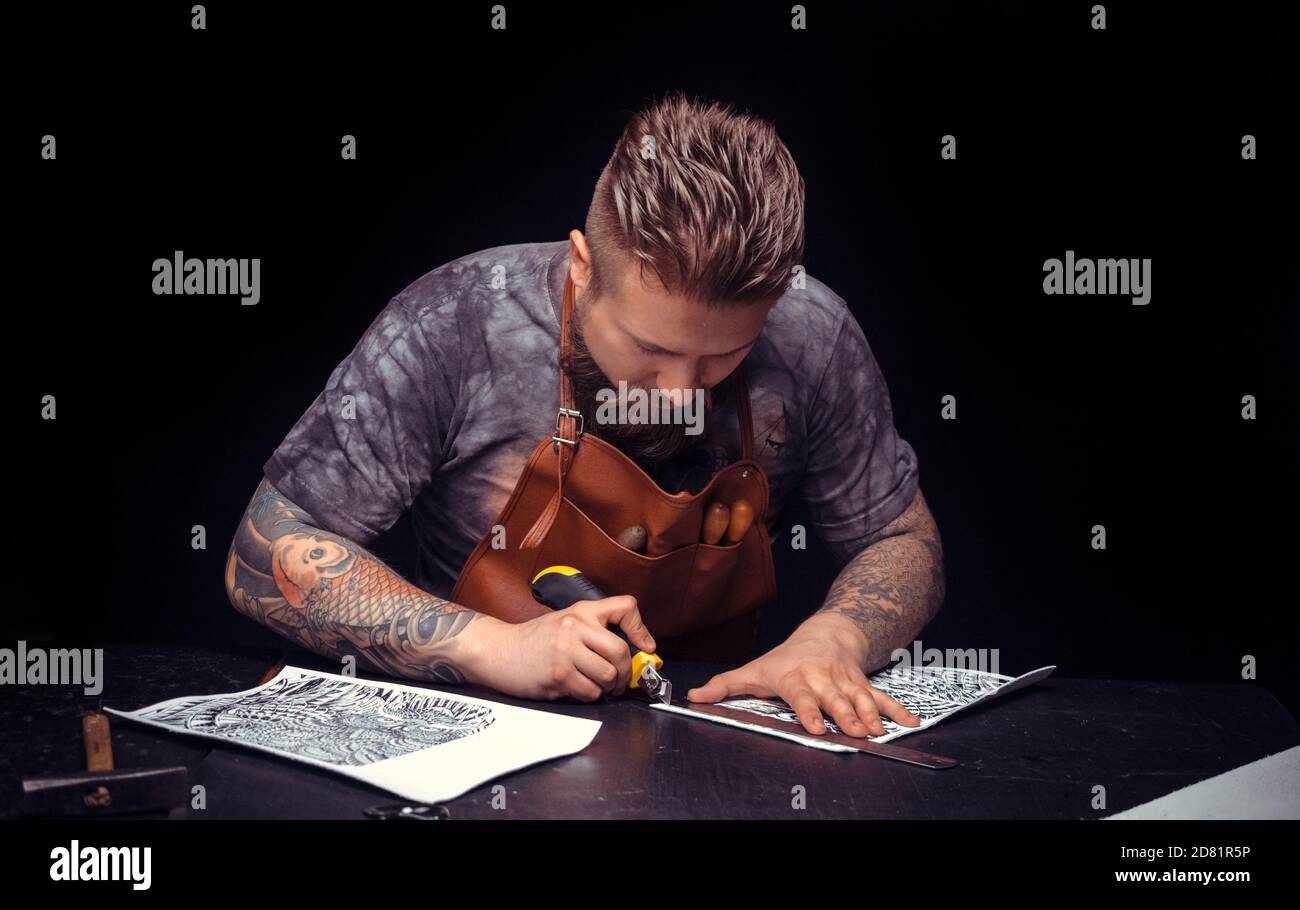 Professional Tanner creates a new leatherwork Stock Photo - Alamy