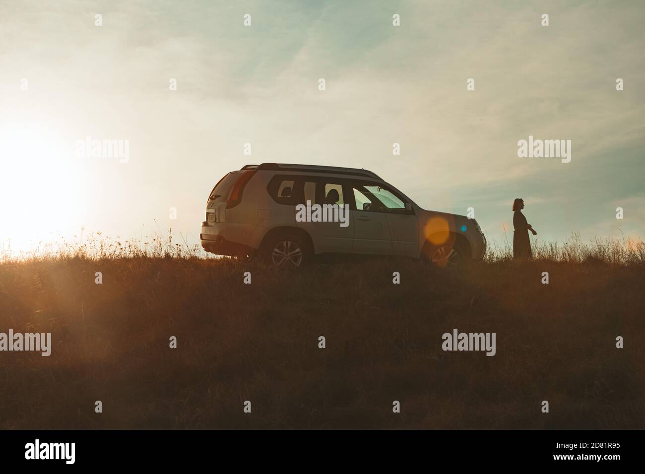 woman silhouette near suv car on sunset Stock Photo - Alamy
