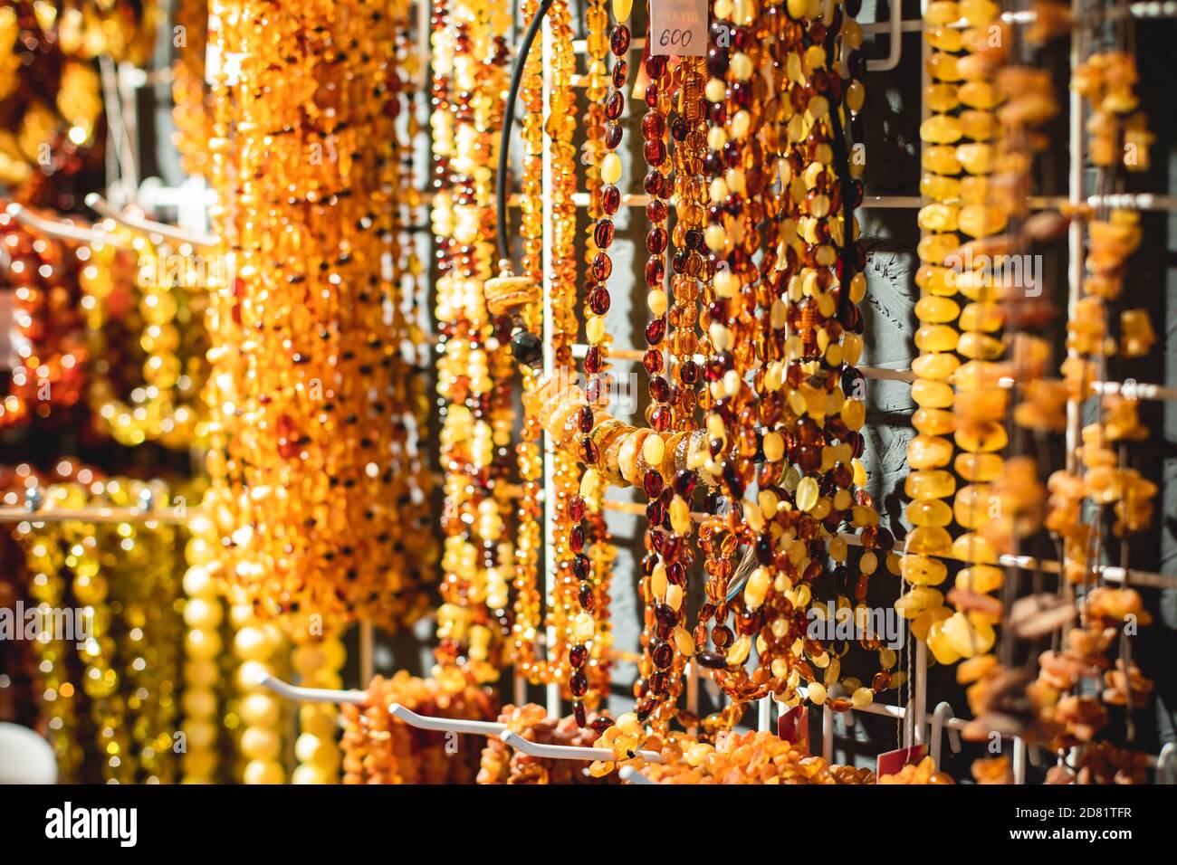 Variety assortment of souvenirs and jewelery made of amber, traditional ...