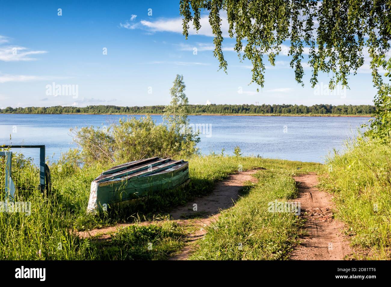 Old boat on the river bank Stock Photo - Alamy