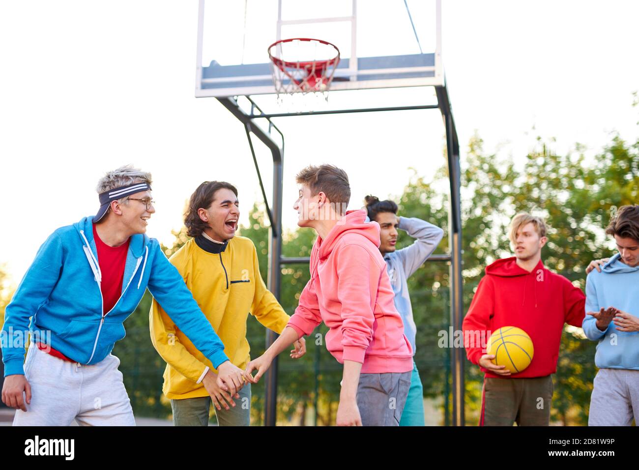 cheerful team celebrate their winning in basketball game, shine with ...