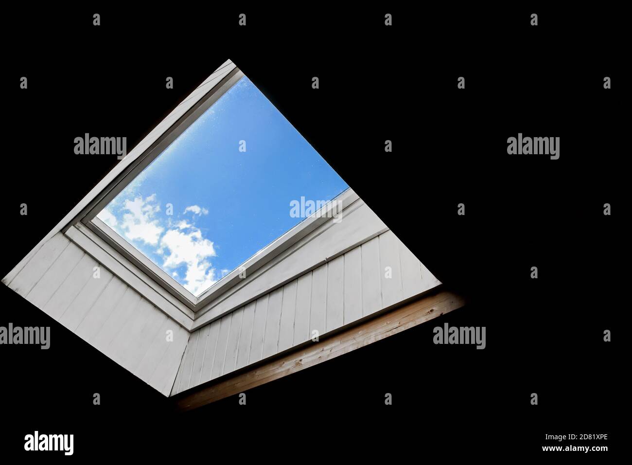 roof window with cloudy blue sky view Stock Photo - Alamy