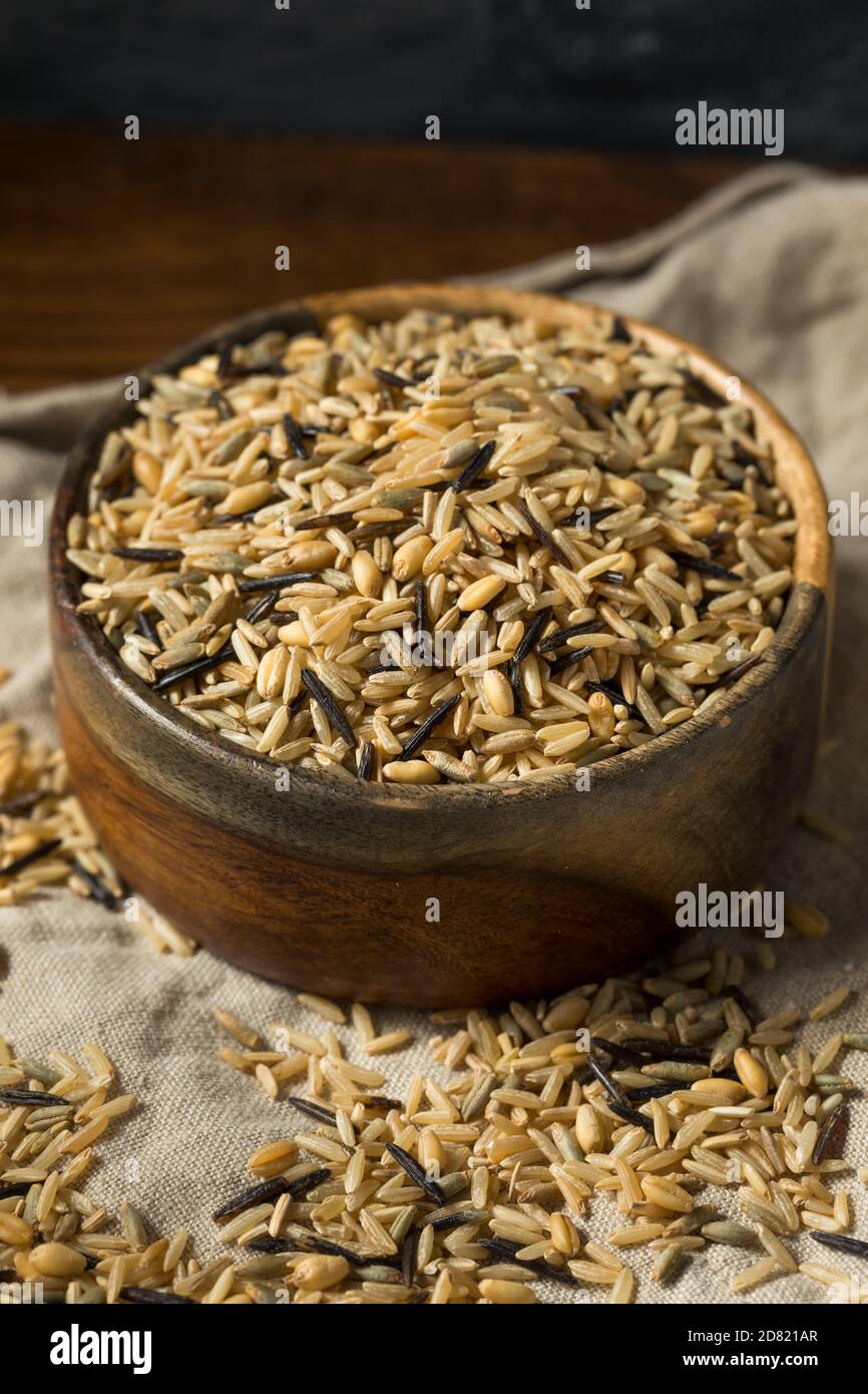 Raw Dry Organic Wild Rice in a Bowl Stock Photo - Alamy