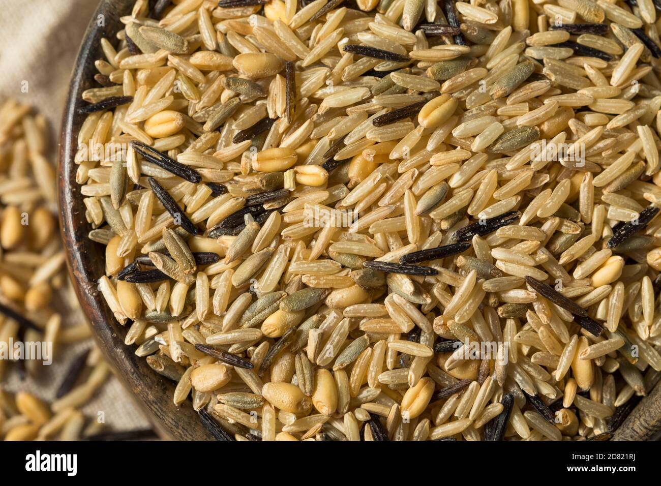 Raw Dry Organic Wild Rice in a Bowl Stock Photo - Alamy