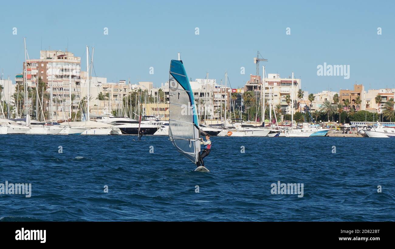 Alicante, Spain - October, 2020: Young people practicing windsurfing ...