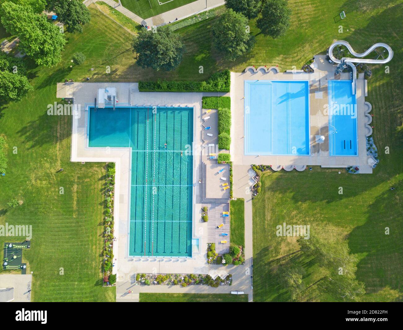 Aerial view of the open air swimming pool in the middle of the summer ...