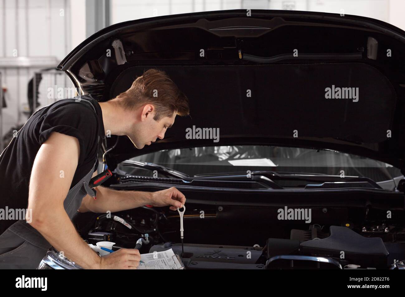 repairing in action. hardworking guy employee in uniform works in the ...