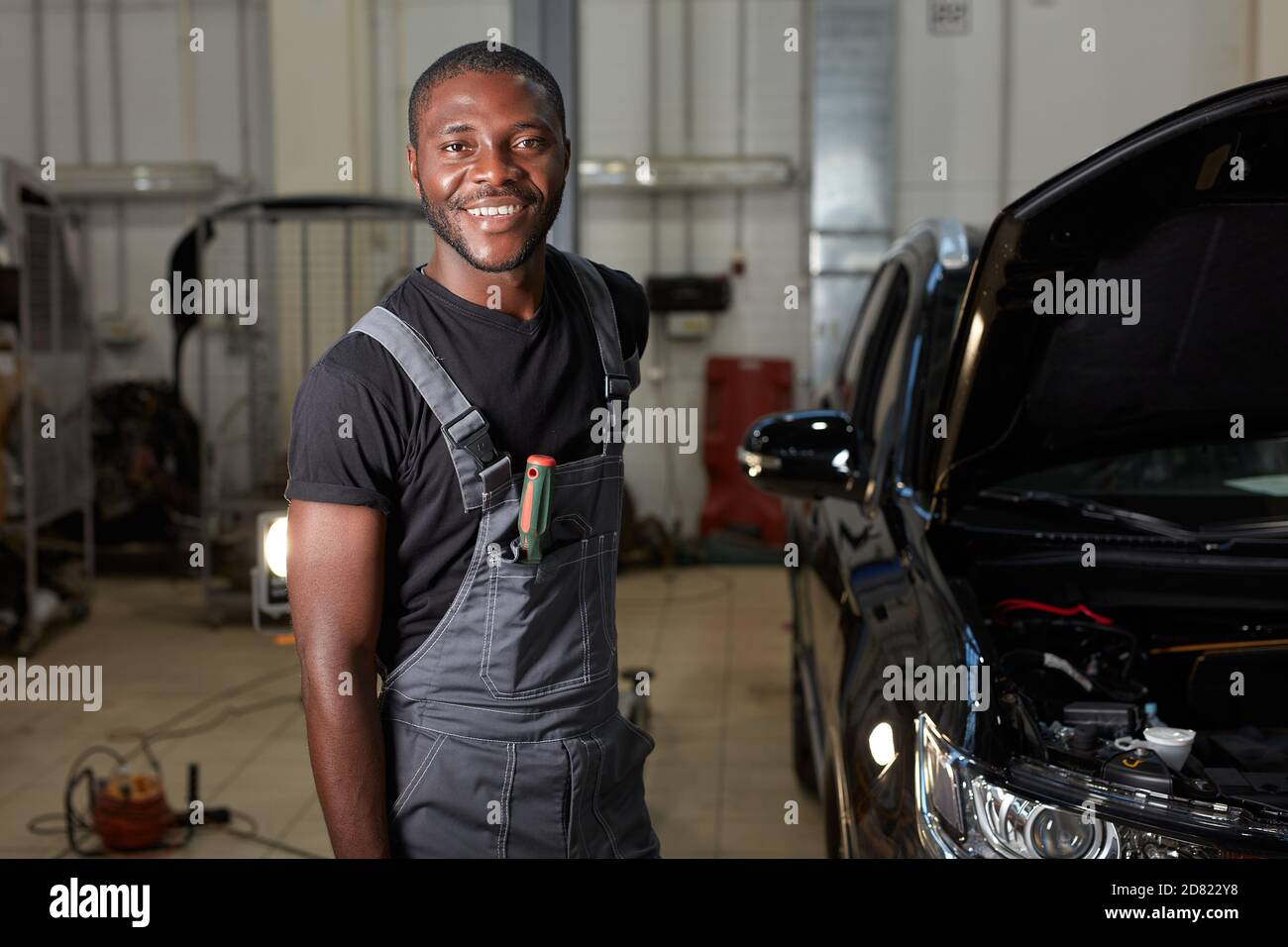 Handsome young african american mechanic hi-res stock photography and ...