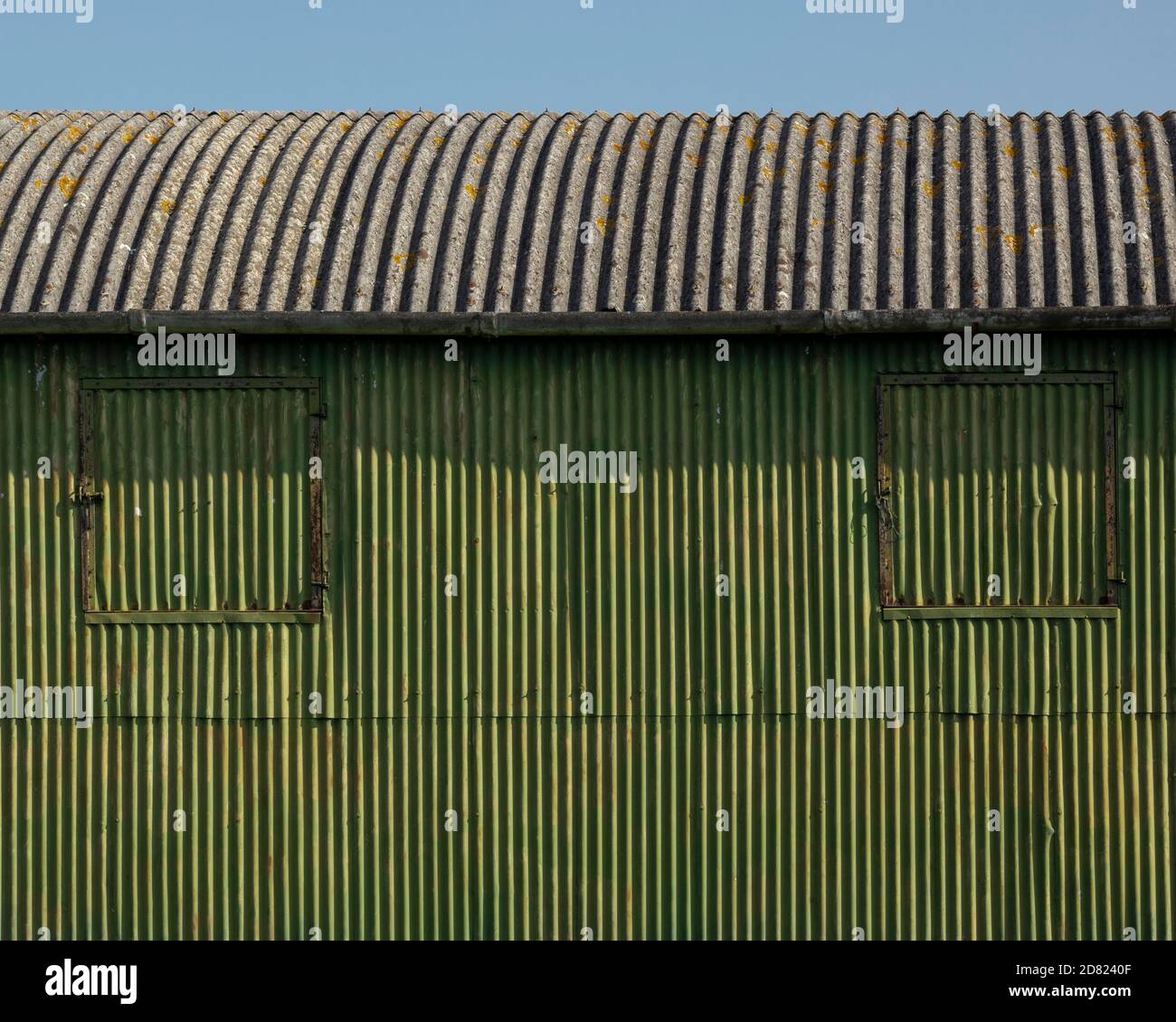A British Dutch Barn painted green Stock Photo - Alamy