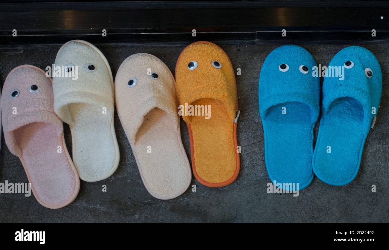 terrycloth slippers with googly eyes Stock Photo - Alamy