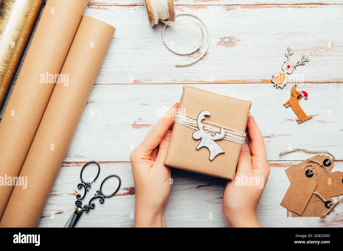 Gift wrapping process, preparation for Xmas Stock Photo - Alamy