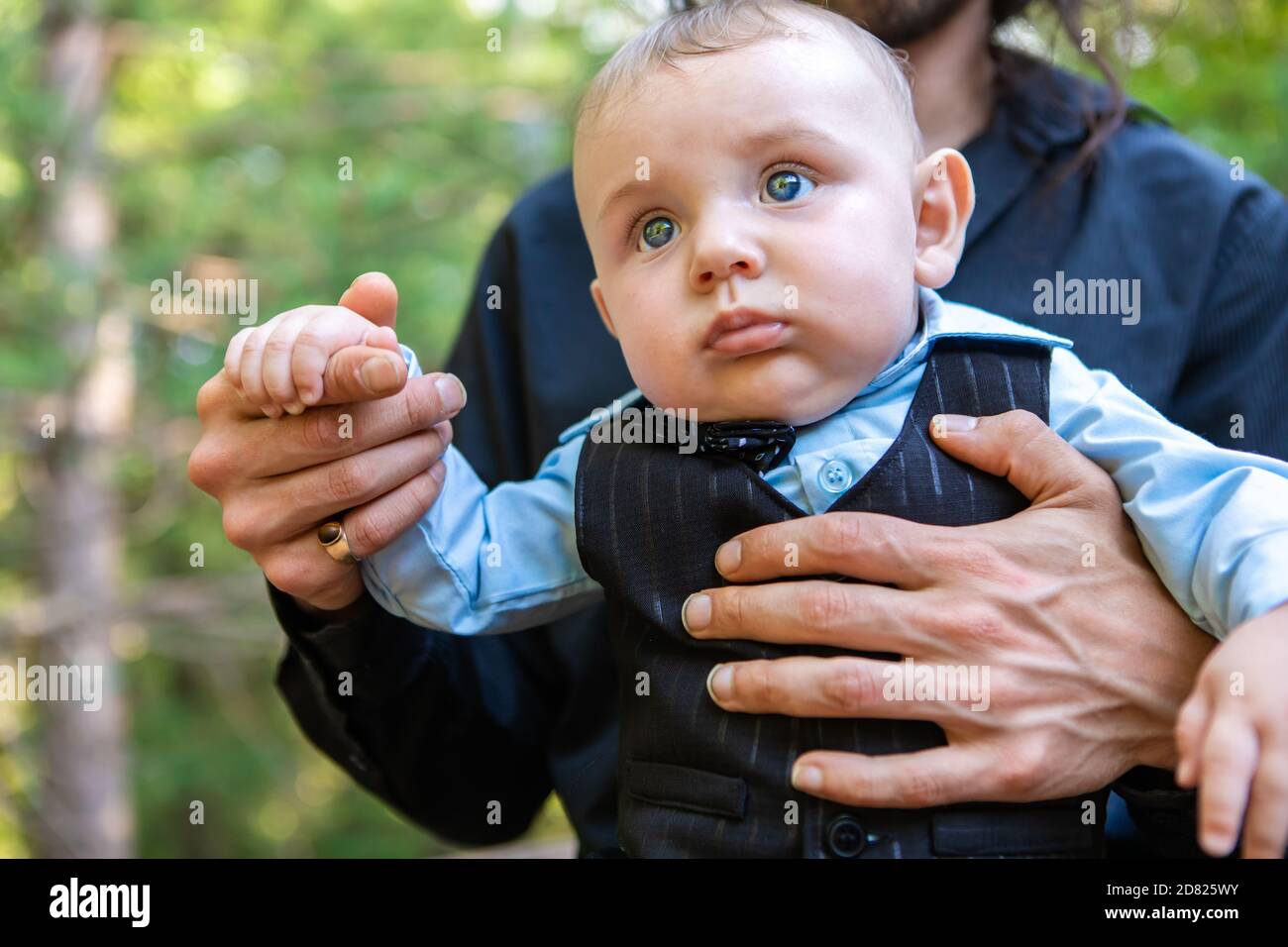 Portrait of cute little infant baby boy dressed in formal clothing with ...