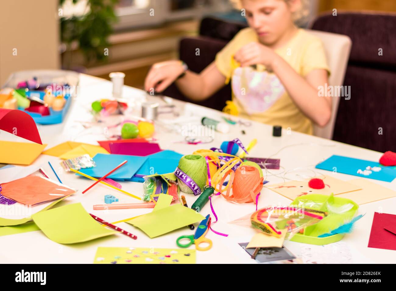 adorable blond girl making christmas card for friends and relatives ...
