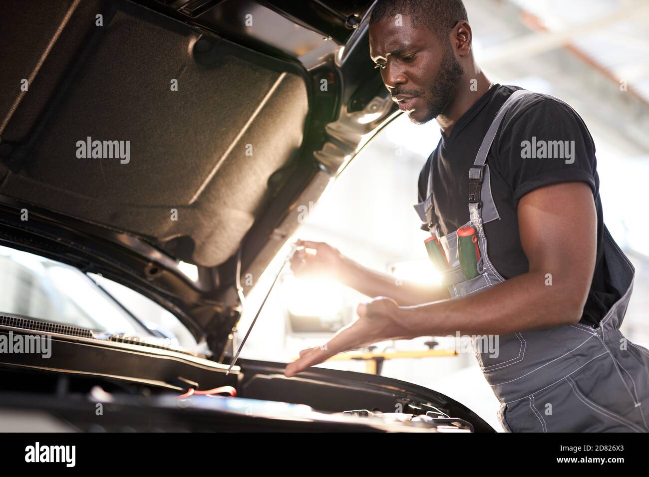 repairing in action. hardworking guy employee in uniform works in the ...