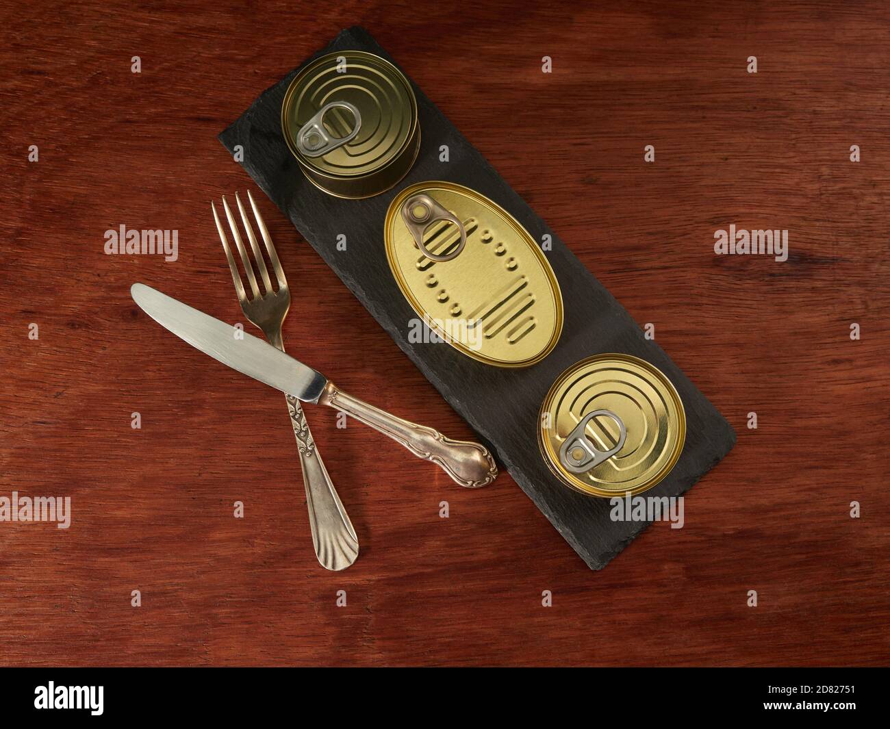 Different types of cans with prepared foods for consumption, vegetables ...