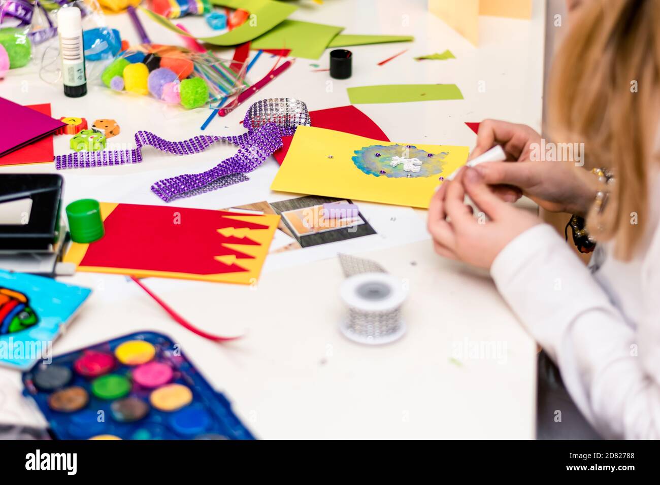 adorable blond girl making christmas card for friends and relatives ...