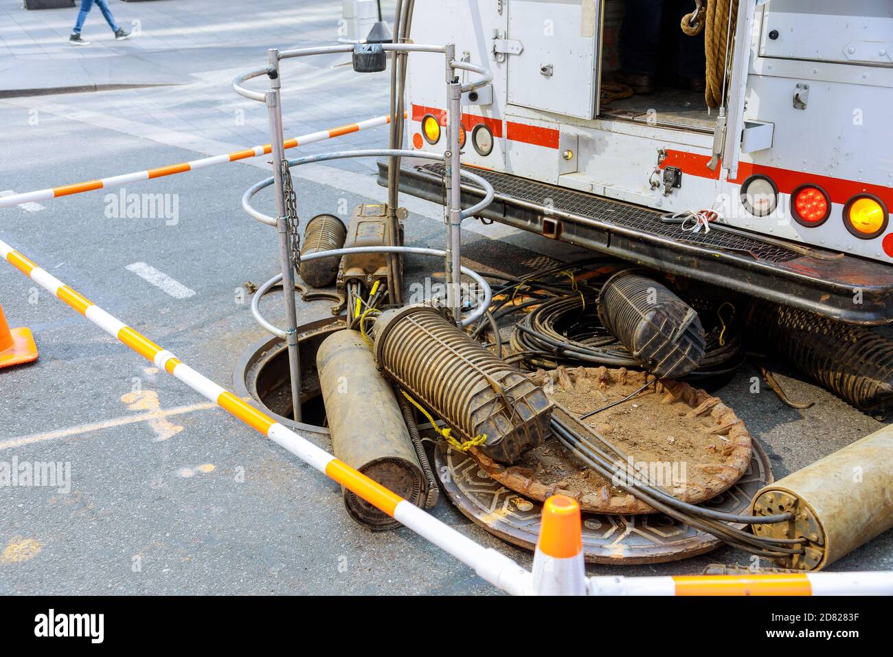 Open manhole with few cables connection internet using fiber optic ...