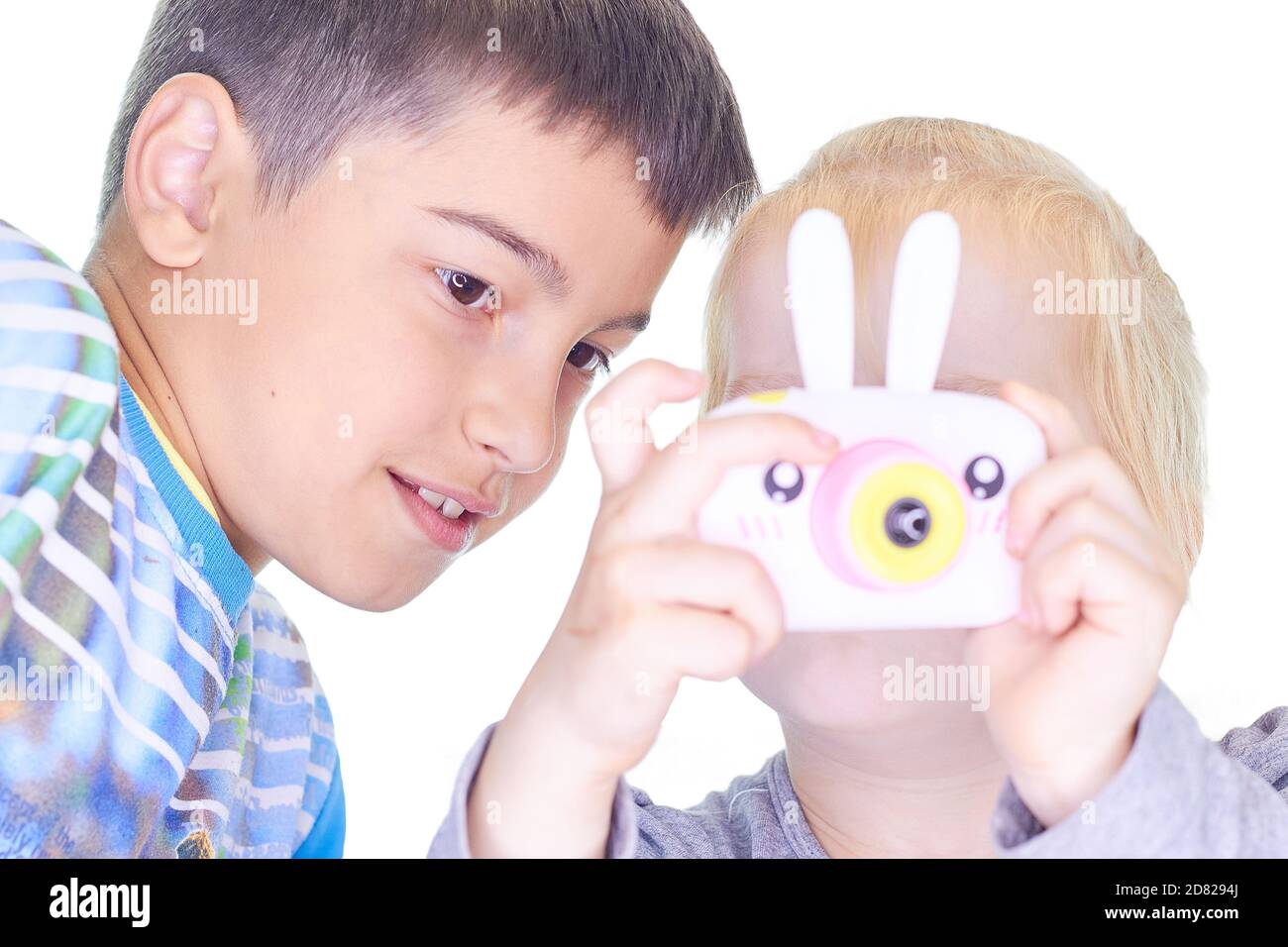 photo of two beautiful children with a camera a Little boy and a girl ...