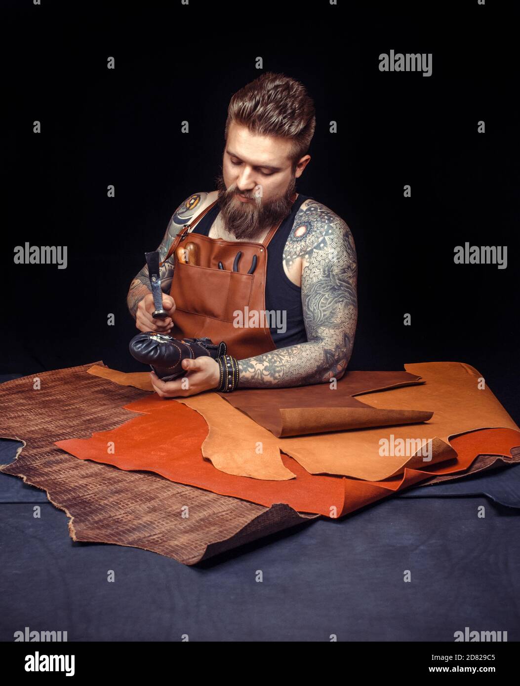 Worker leather works goods hi-res stock photography and images - Alamy