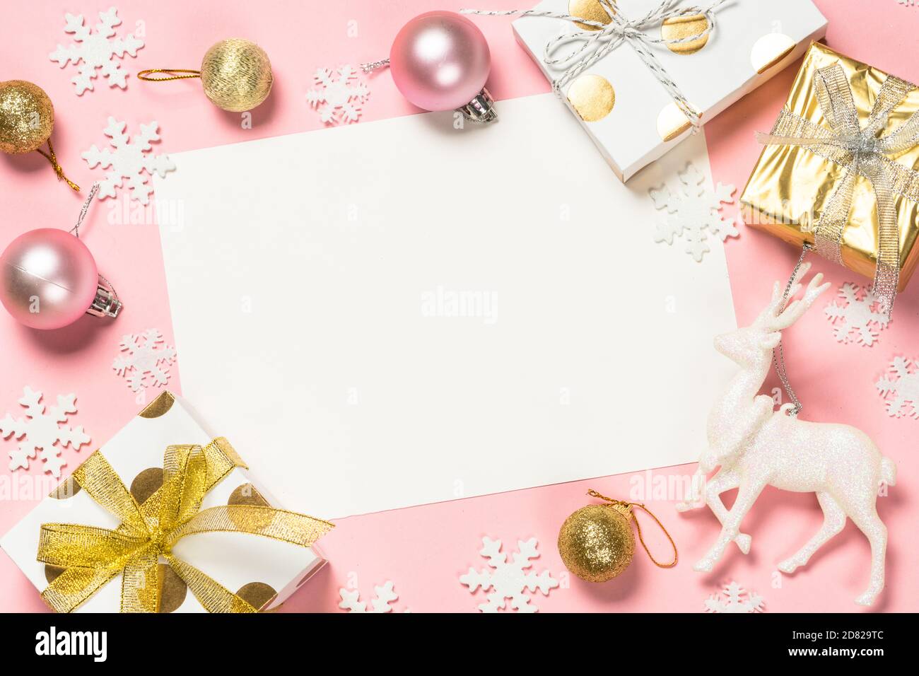 Christmas pink flat lay background with present box and decorations ...