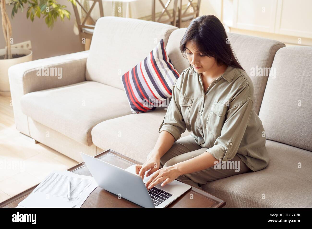 Young indian woman student using laptop learning online at home Stock ...