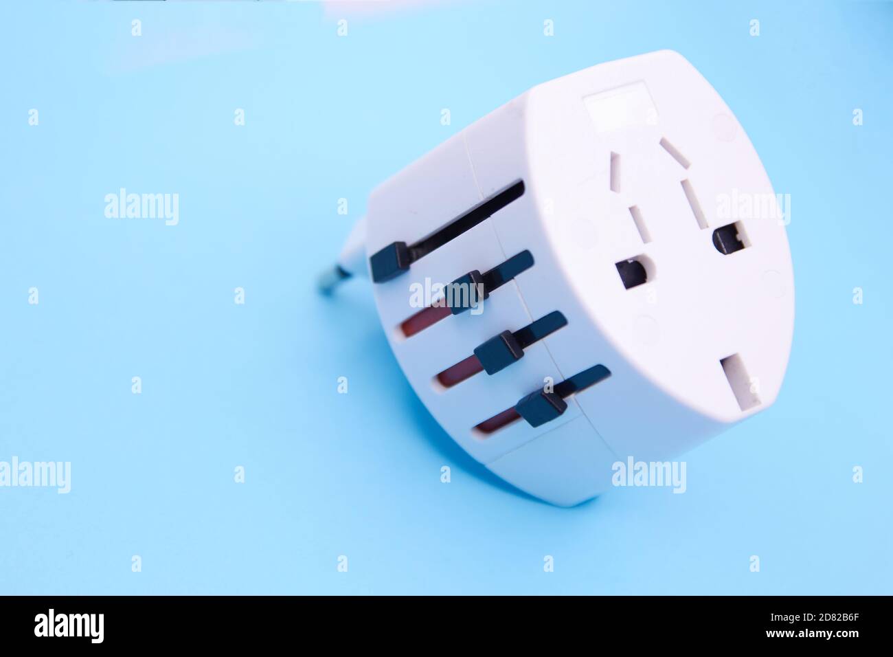 adapter electric adapter multifunctional white on a blue background ...