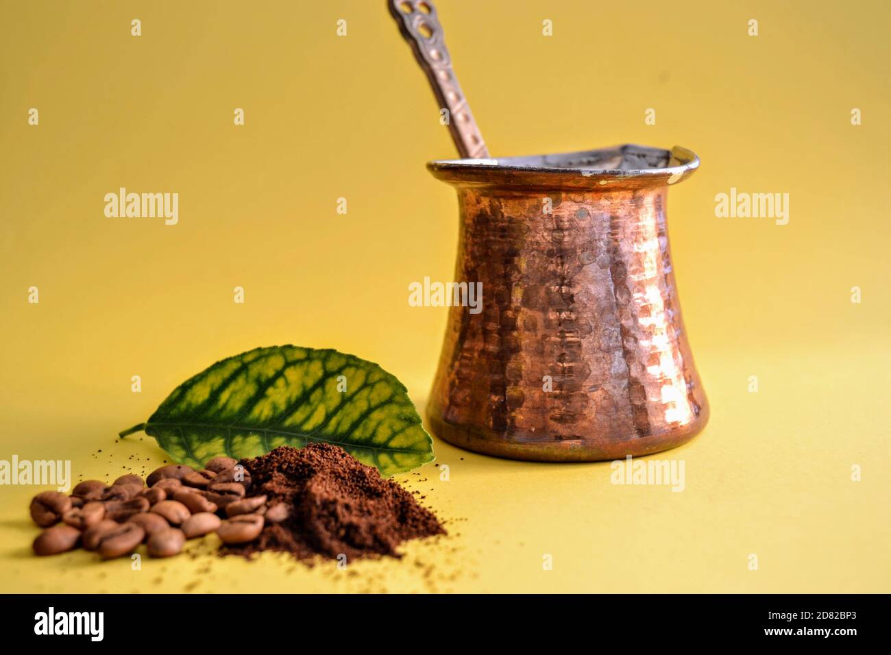 Cooked turkish coffee in traditional pot. coffee beans and roasted ...