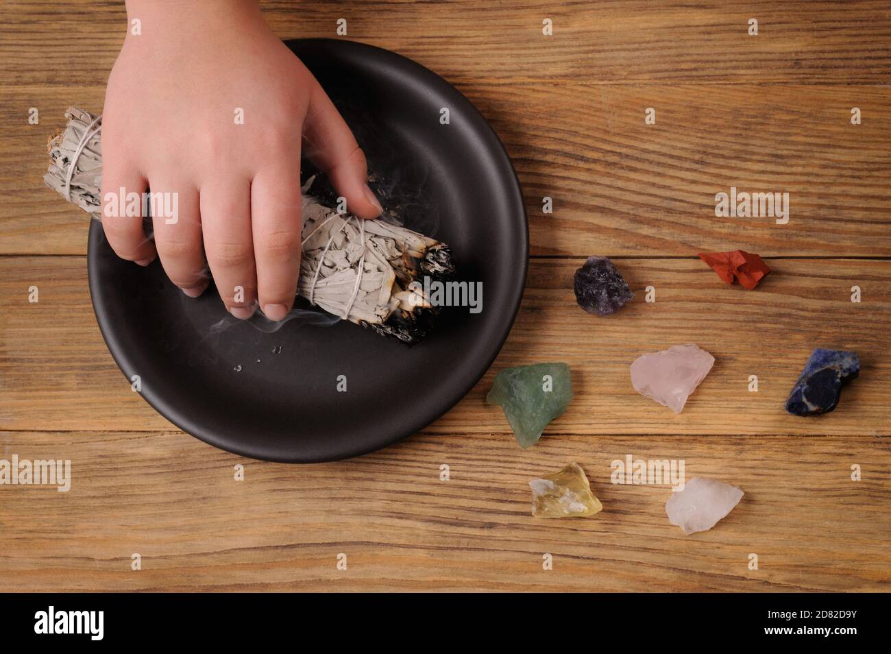 Smudging ritual using burning bundle of White Sage. Image with healing ...