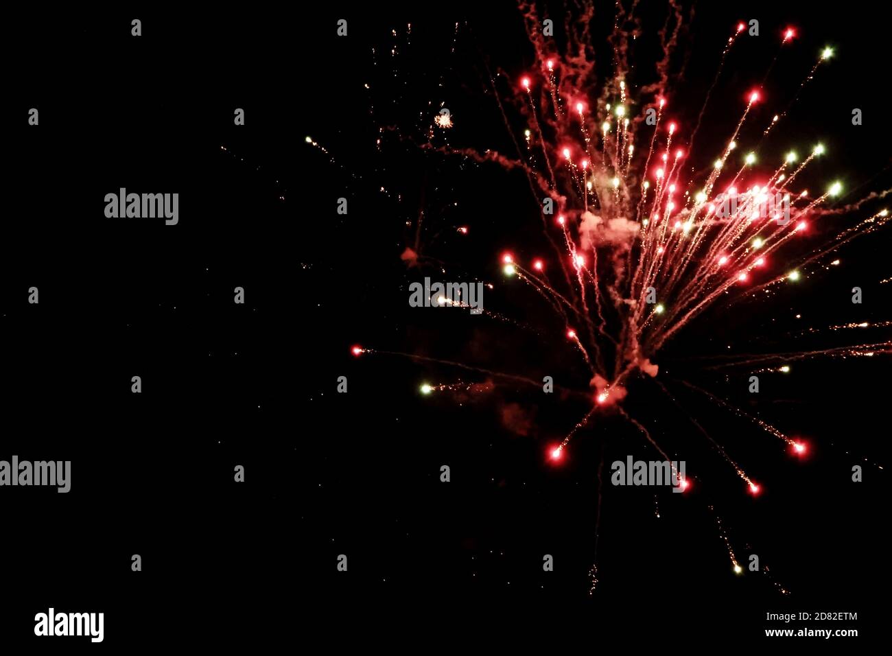 red firework in dark sky at night Stock Photo - Alamy