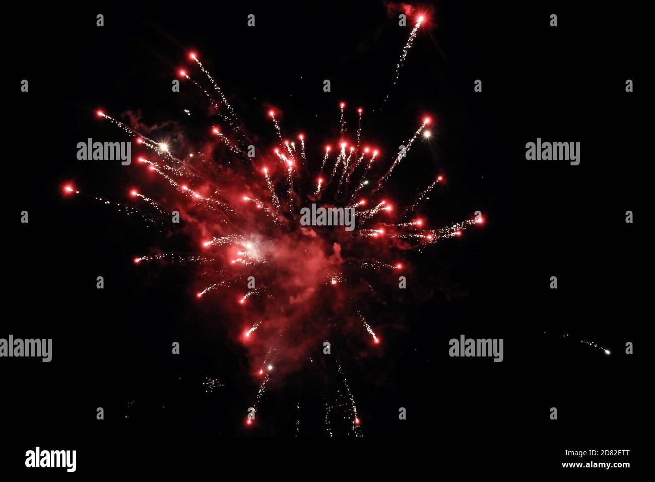 red firework in dark sky at night Stock Photo - Alamy